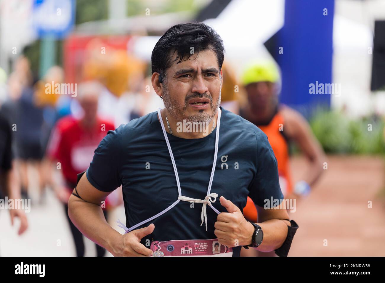 A man running the International Marathon of Mexico city on the street ...