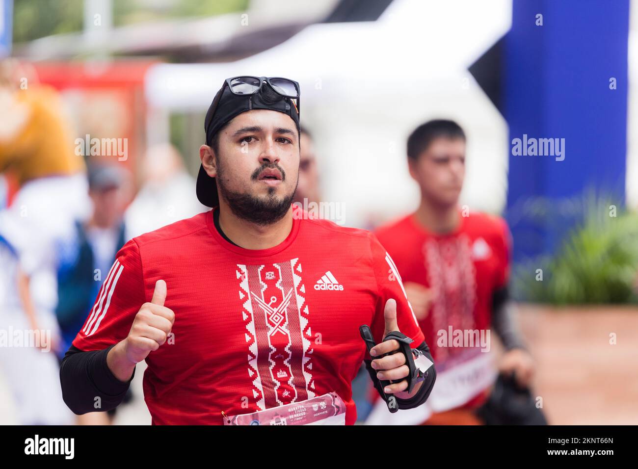 A man running the International Marathon of Mexico city on the street ...