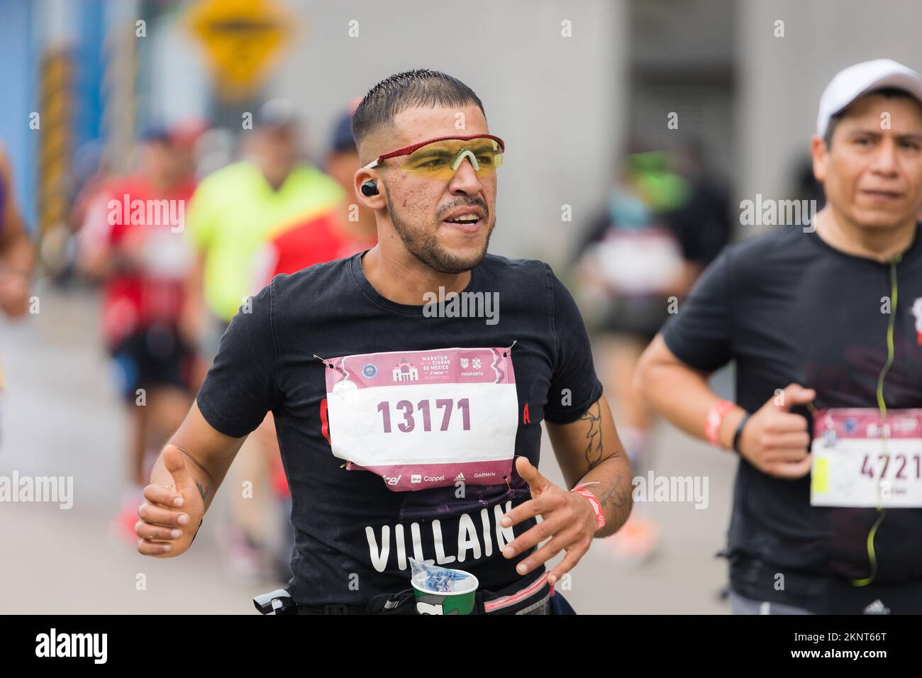 A man running the International Marathon of Mexico city on the street ...