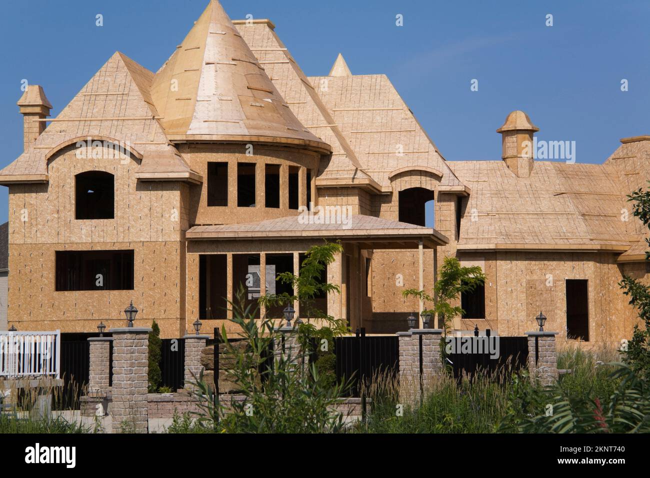 Partially constructed luxurious home in upscale residential housing ...