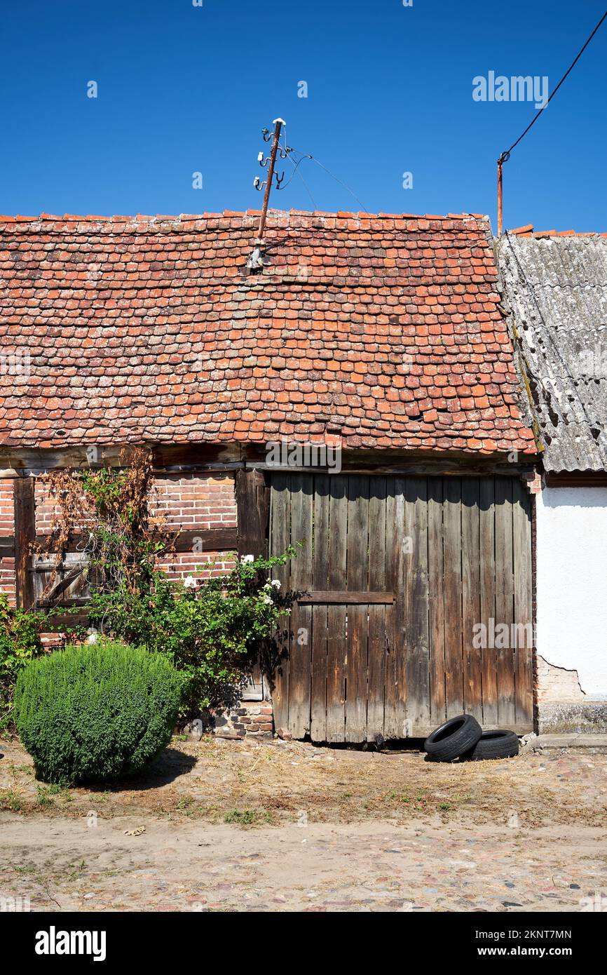 A dilapidated, old timber-frame house in Bledzew in Poland Stock Photo ...