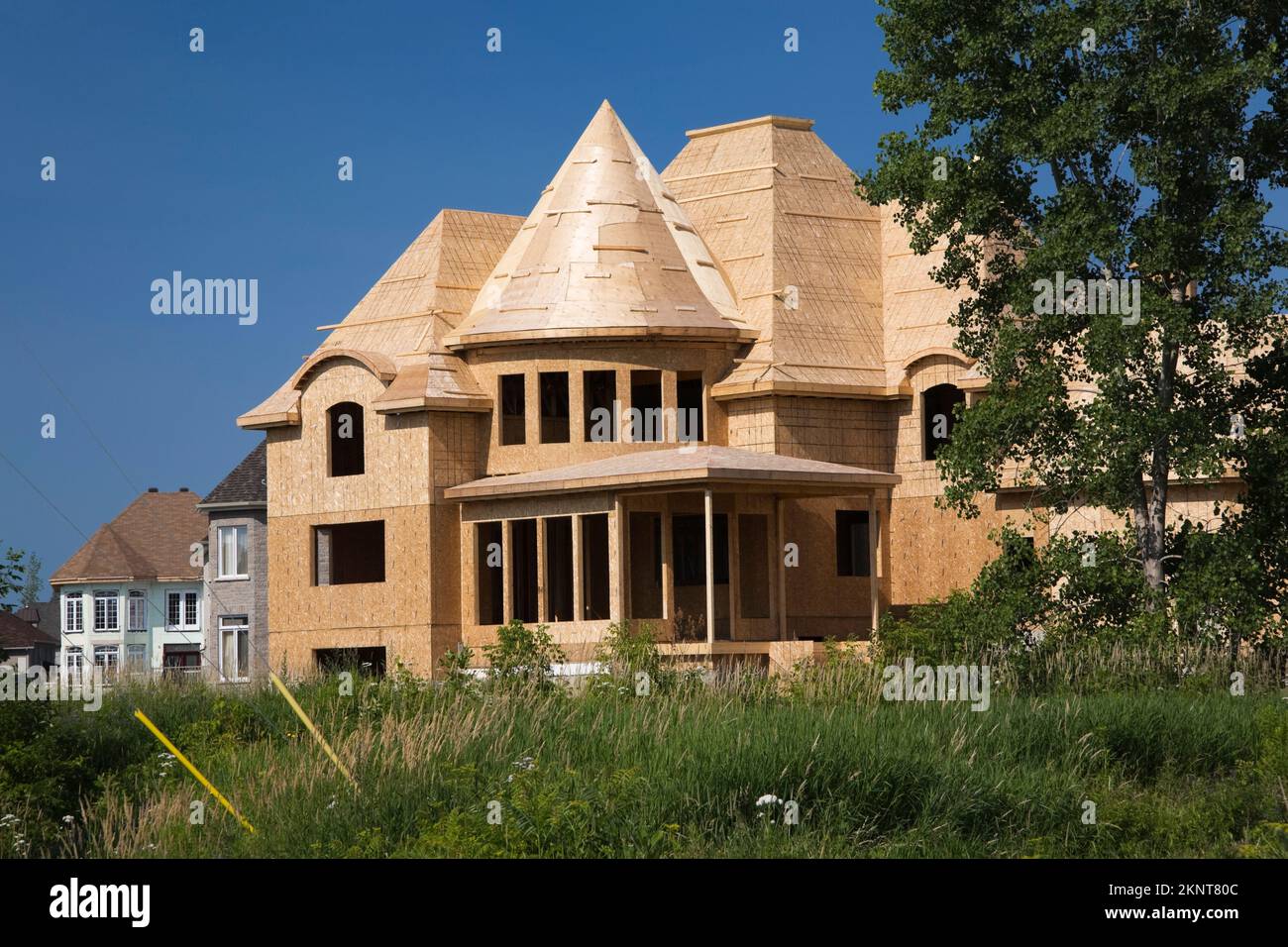 Partially constructed luxurious home in upscale residential housing ...