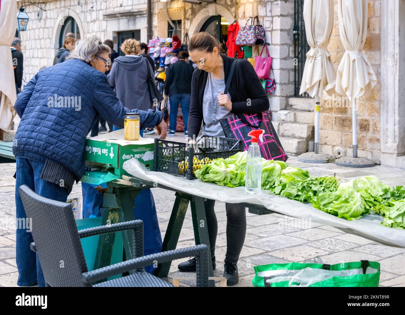 Lady buying fresh vegetables from local market stall, Dubrovnik ...