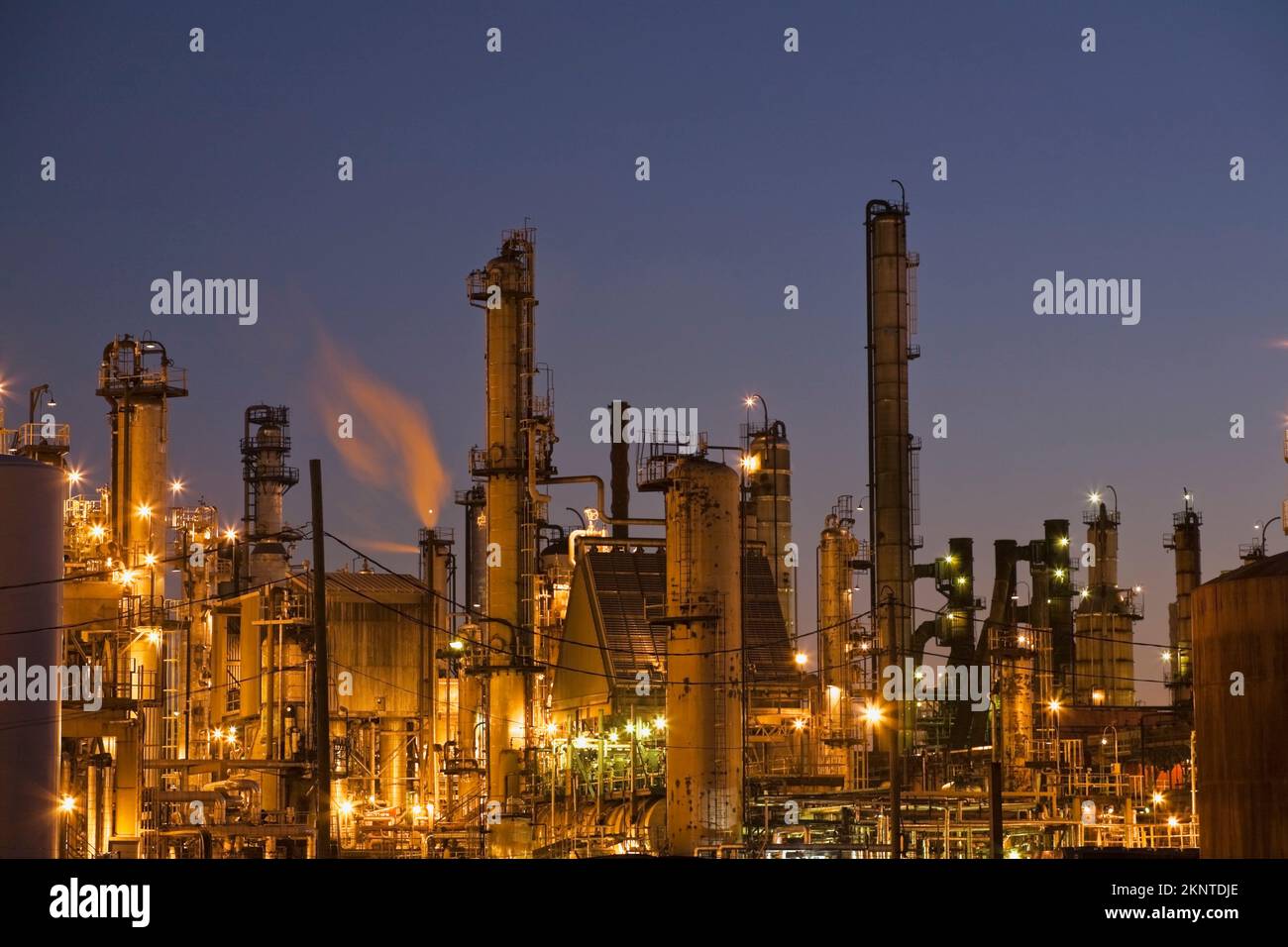Oil refinery illuminated at dusk, Montreal East, Quebec, Canada Stock ...