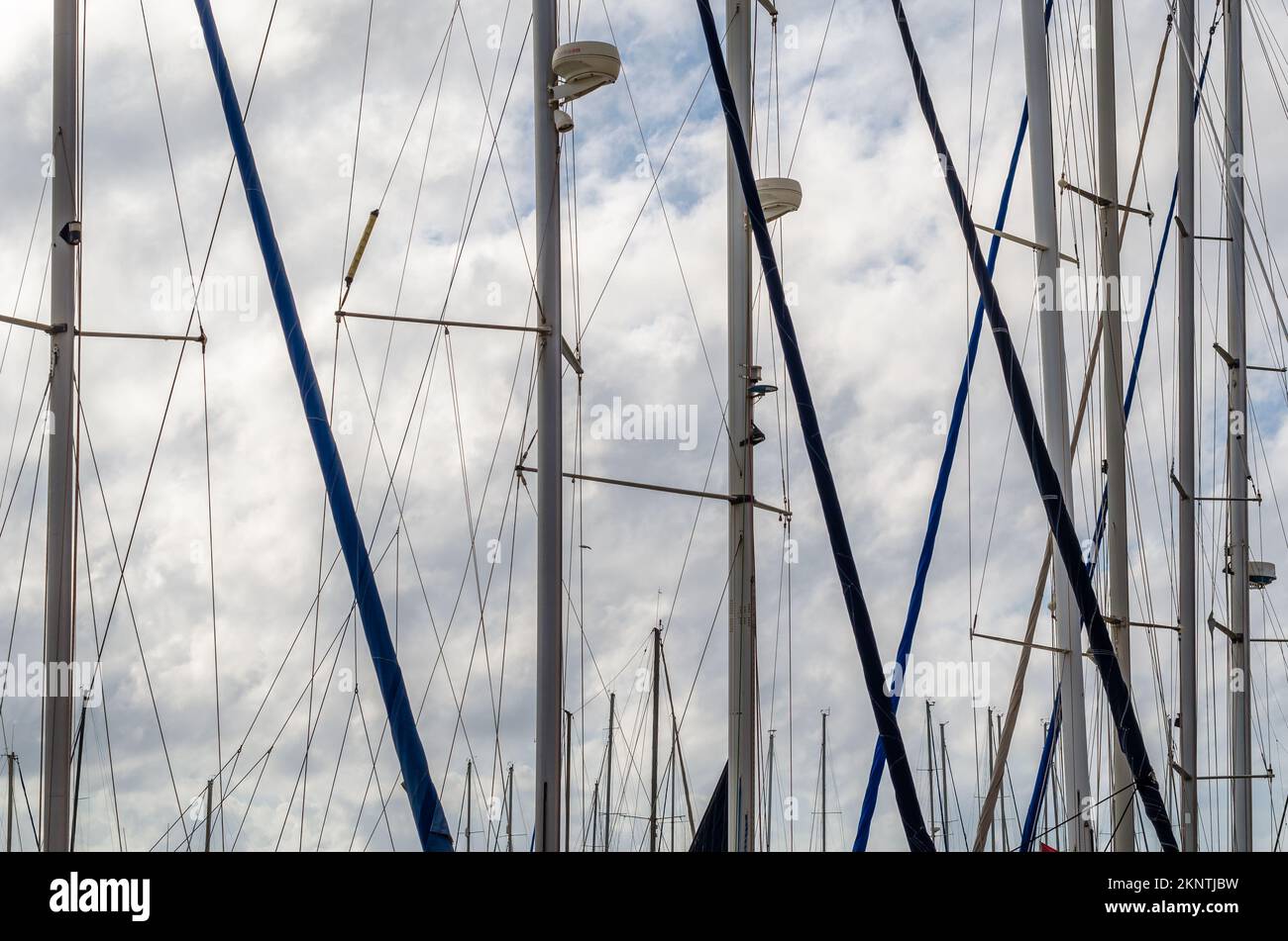 Detail of ship masts in a port Stock Photo - Alamy