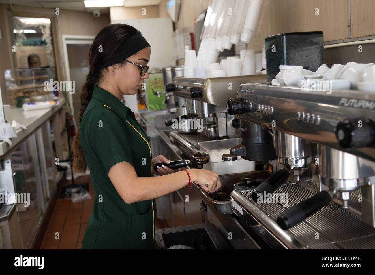 A server is making Cuban coffee at the restaurant. Felipe Valls Sr ...