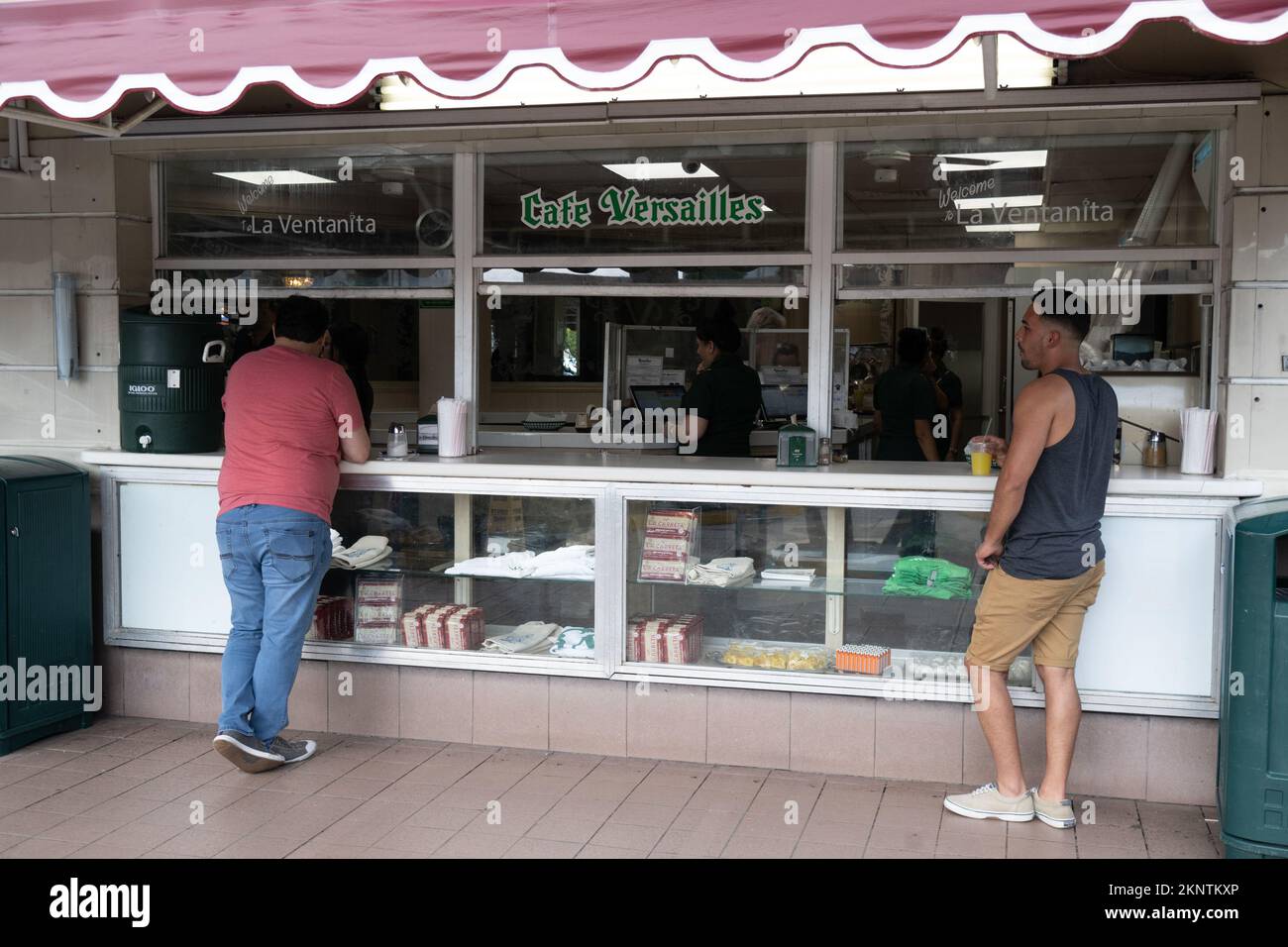 People are seen at the Cuban coffee spot at the restaurant. A server ...