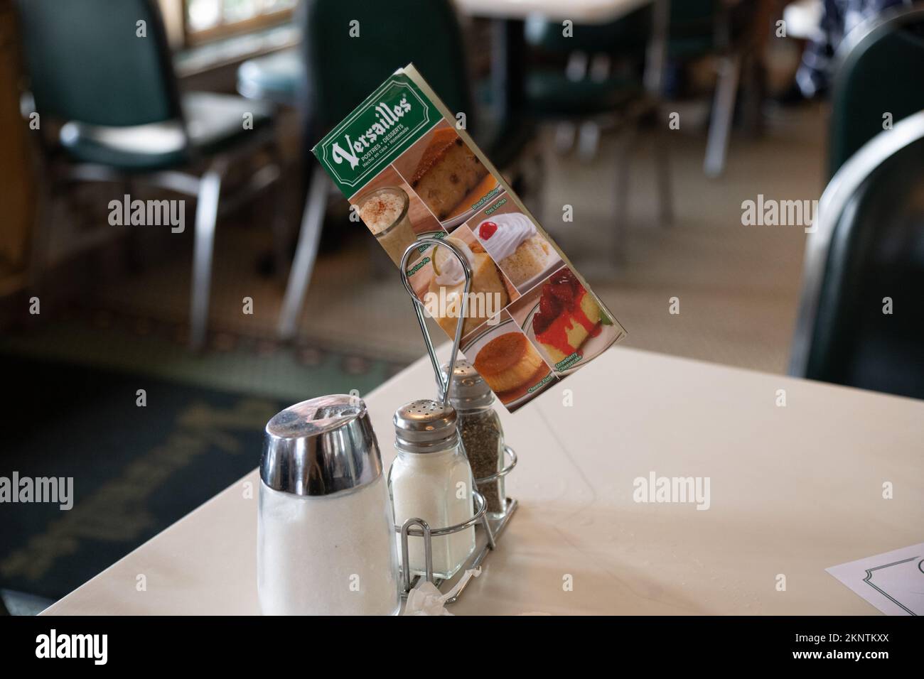 A menu is displayed on the table in the restaurant. Felipe Valls Sr ...