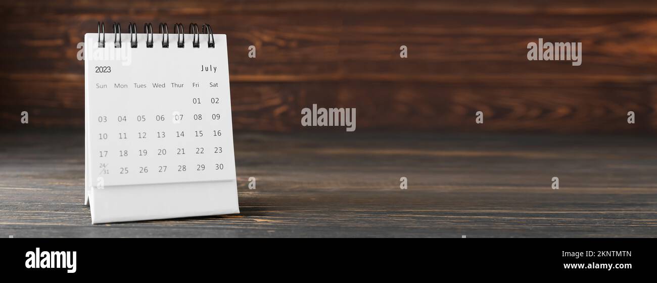 Flip paper calendar on wooden background with space for text Stock ...