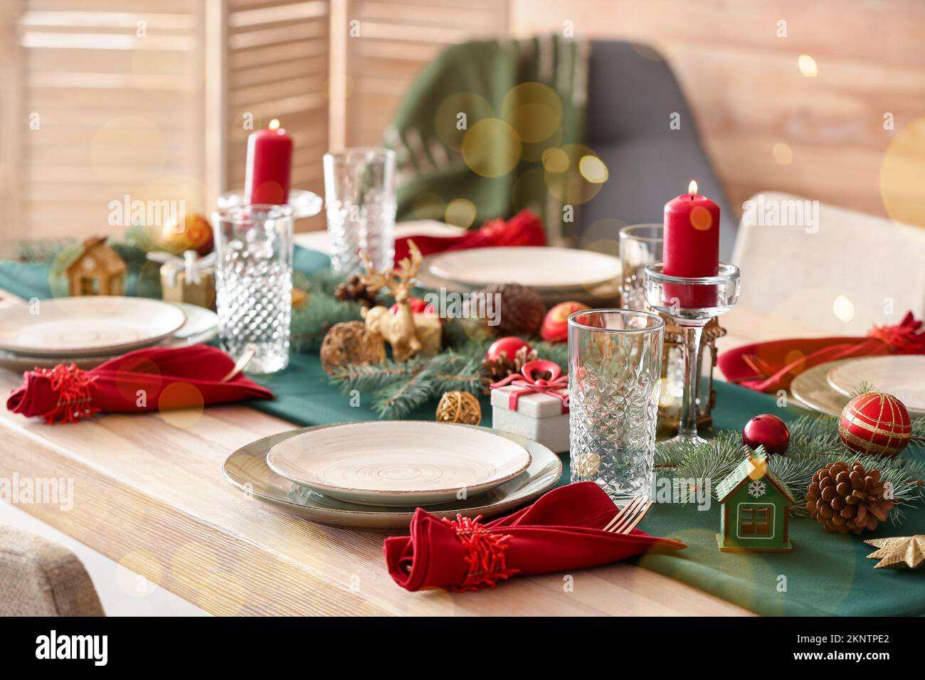 Fairy table setting for Christmas dinner in room Stock Photo - Alamy