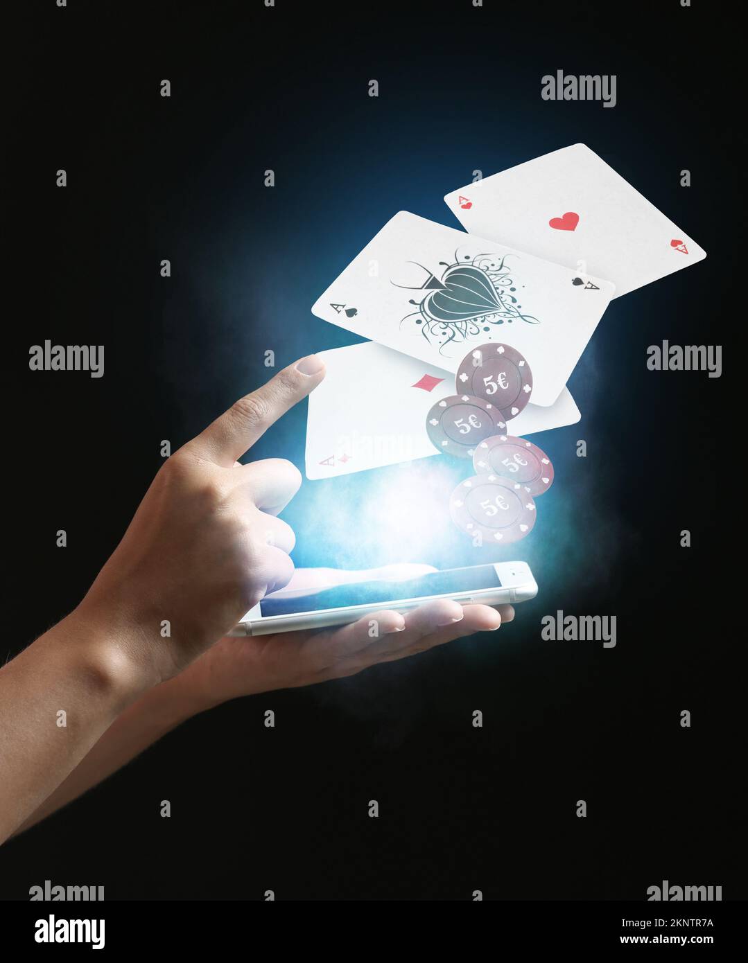 Female hands with mobile phone, flying poker chips and playing cards on ...