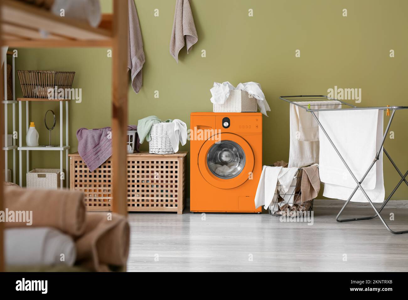 Interior of modern home laundry room with orange washing machine Stock ...
