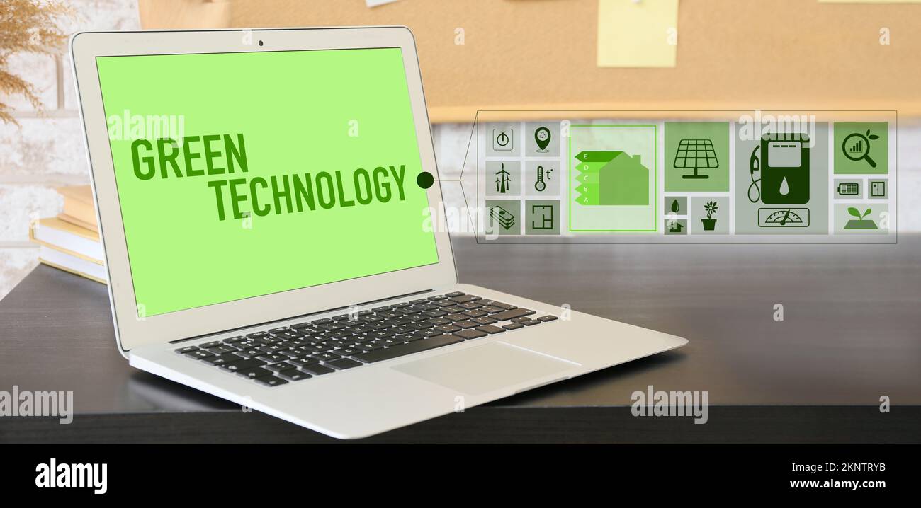 Laptop with text GREEN TECHNOLOGY on screen in office Stock Photo - Alamy