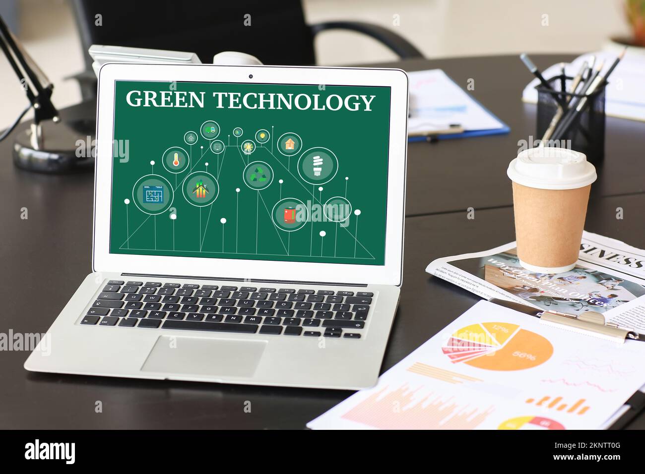 Laptop with text GREEN TECHNOLOGY on screen in office Stock Photo - Alamy