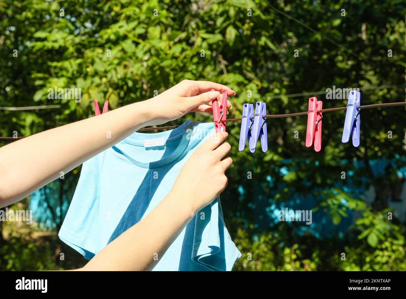 Drying hands on shirt hi-res stock photography and images - Alamy