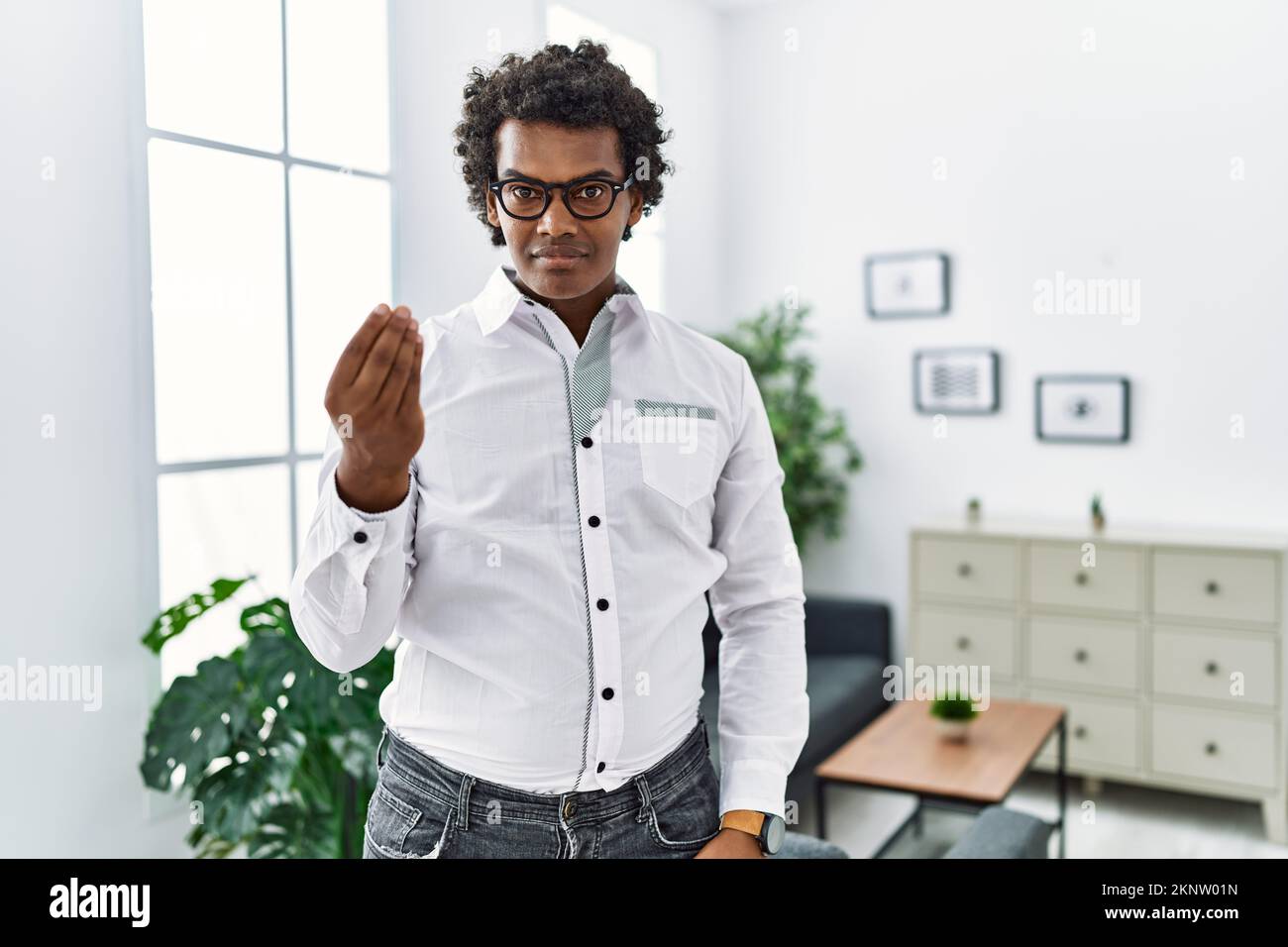 African psychologist man at consultation office doing italian gesture ...