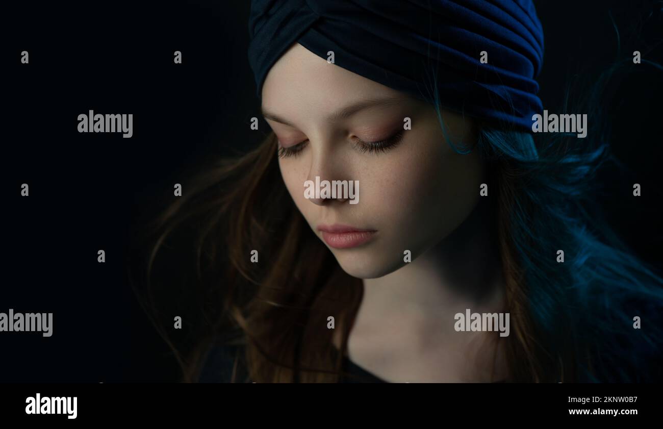 Beautiful little teenager girl with meditative facial expression in ...