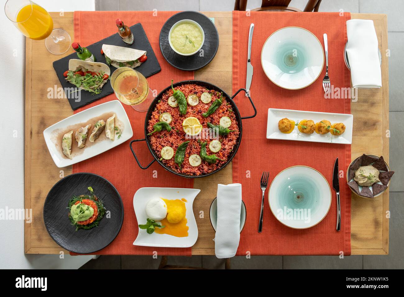 A top view of a laid table with various Spanish and Mexican cuisine ...