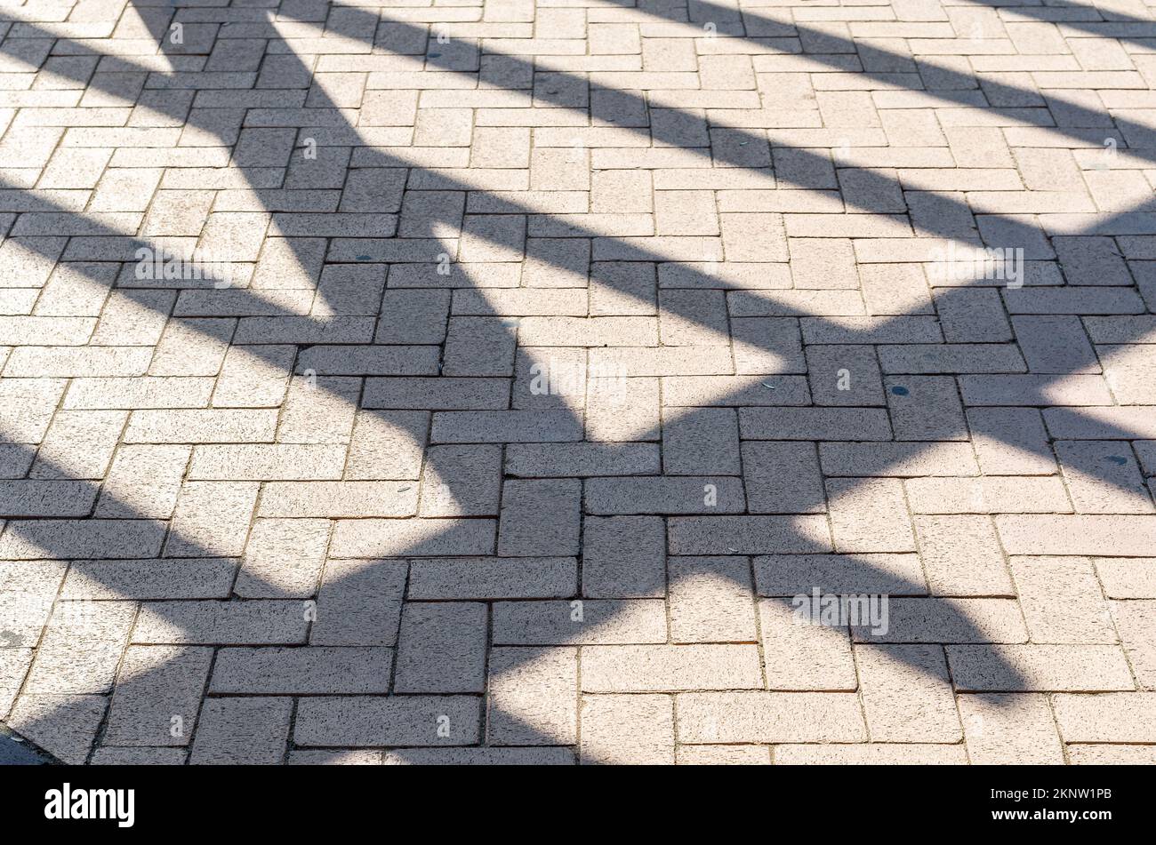 Pattern of shadows on the pavement, abstract background Stock Photo - Alamy