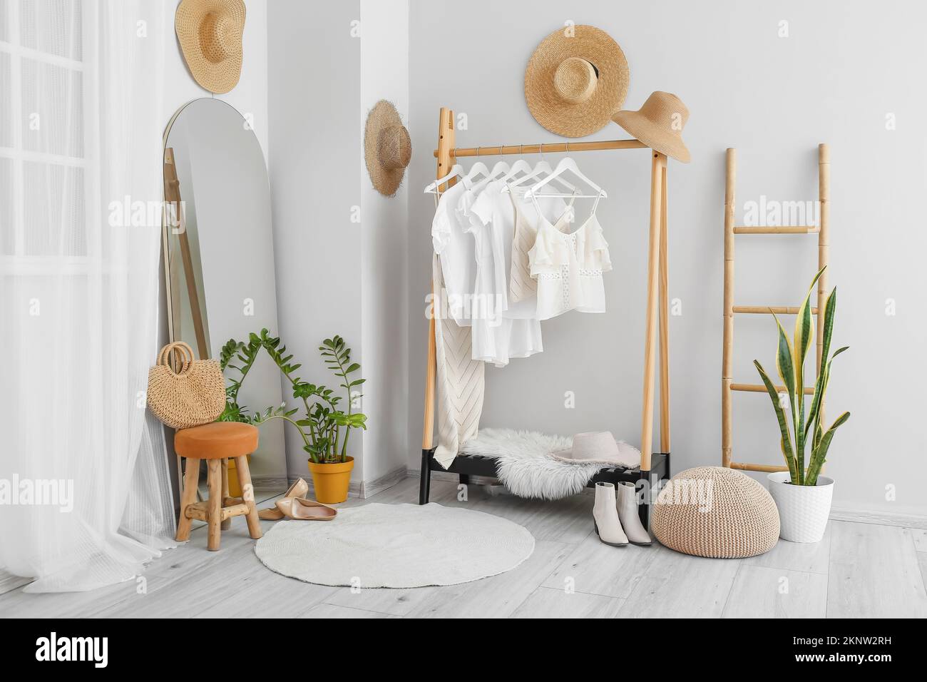 Interior of light dressing room with clothes, mirror and ladder Stock ...