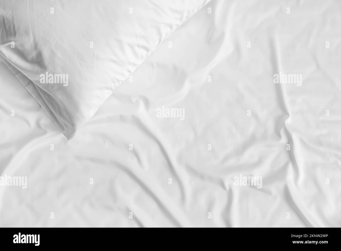 White bed sheet and soft pillow, closeup Stock Photo - Alamy