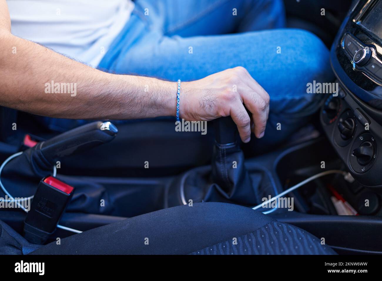 Young hispanic man touching gear shift car at street Stock Photo - Alamy