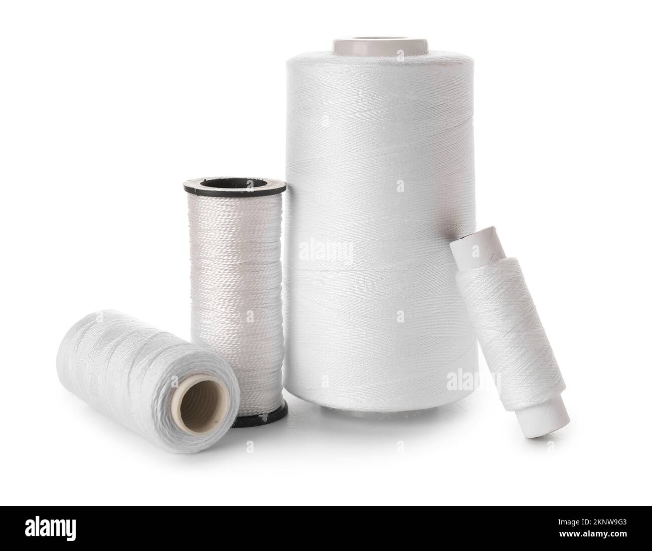 Different sewing thread spools isolated on white background Stock Photo ...