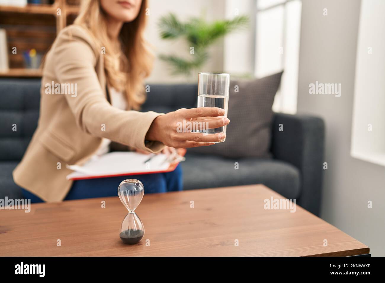 Doctor offering glass water hi-res stock photography and images - Alamy