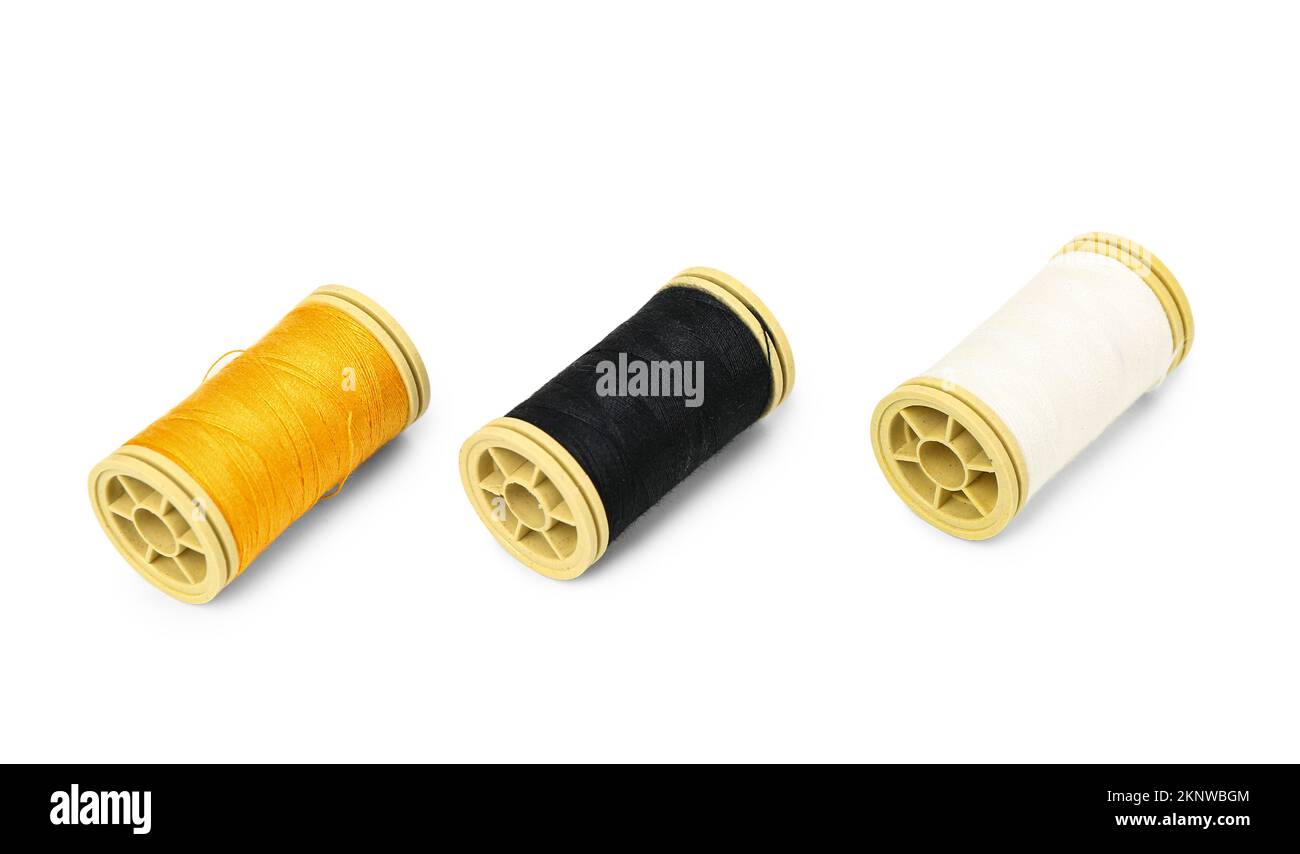 Different thread spools isolated on white background Stock Photo - Alamy