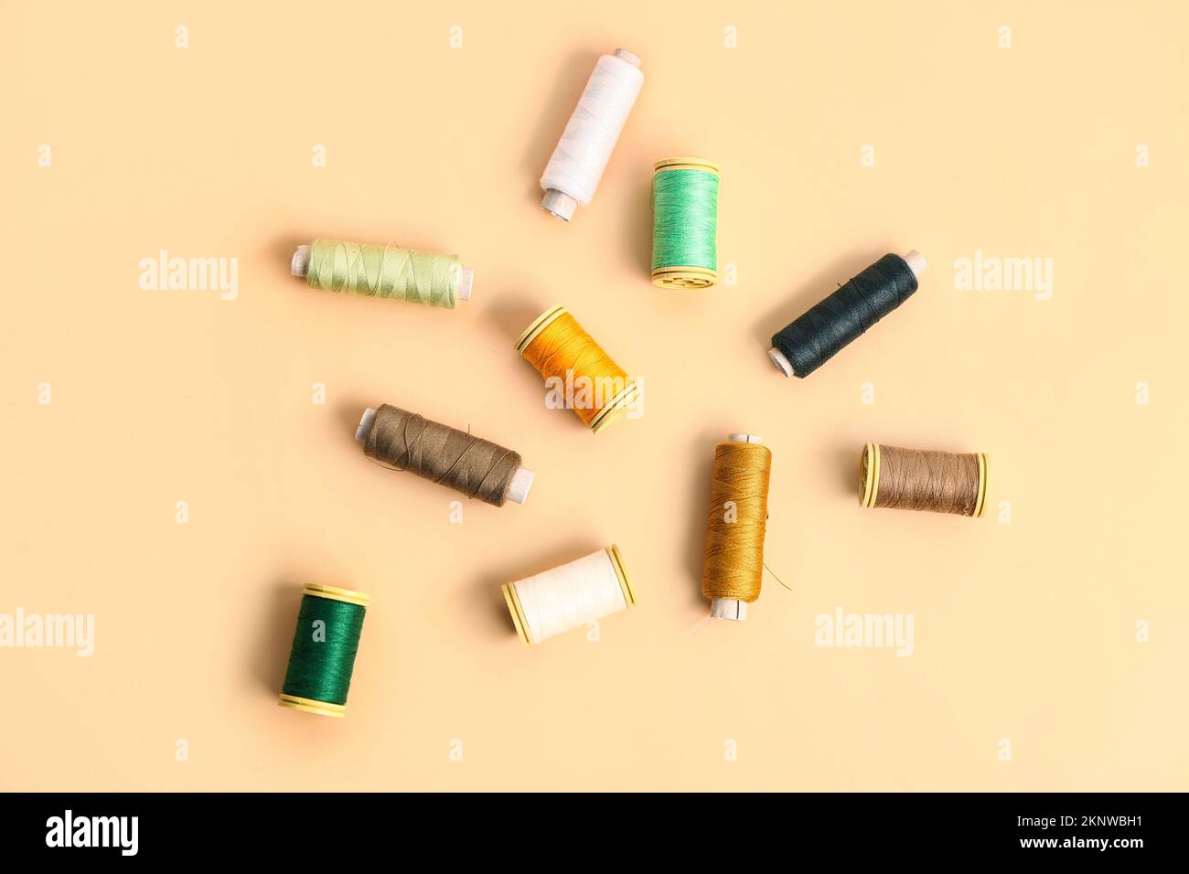 Set of different thread spools on color background Stock Photo - Alamy