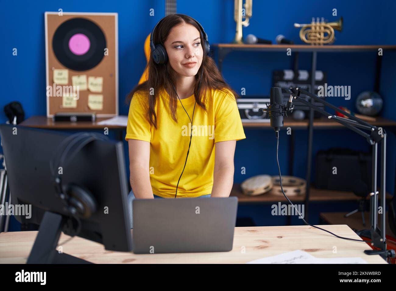 Young woman musician having dj session at music studio Stock Photo - Alamy