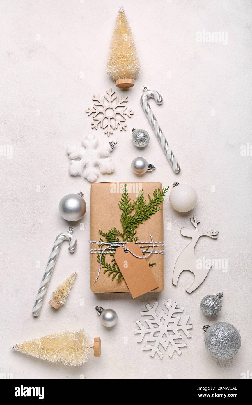 Christmas tree made of gift box and beautiful decorations on light ...