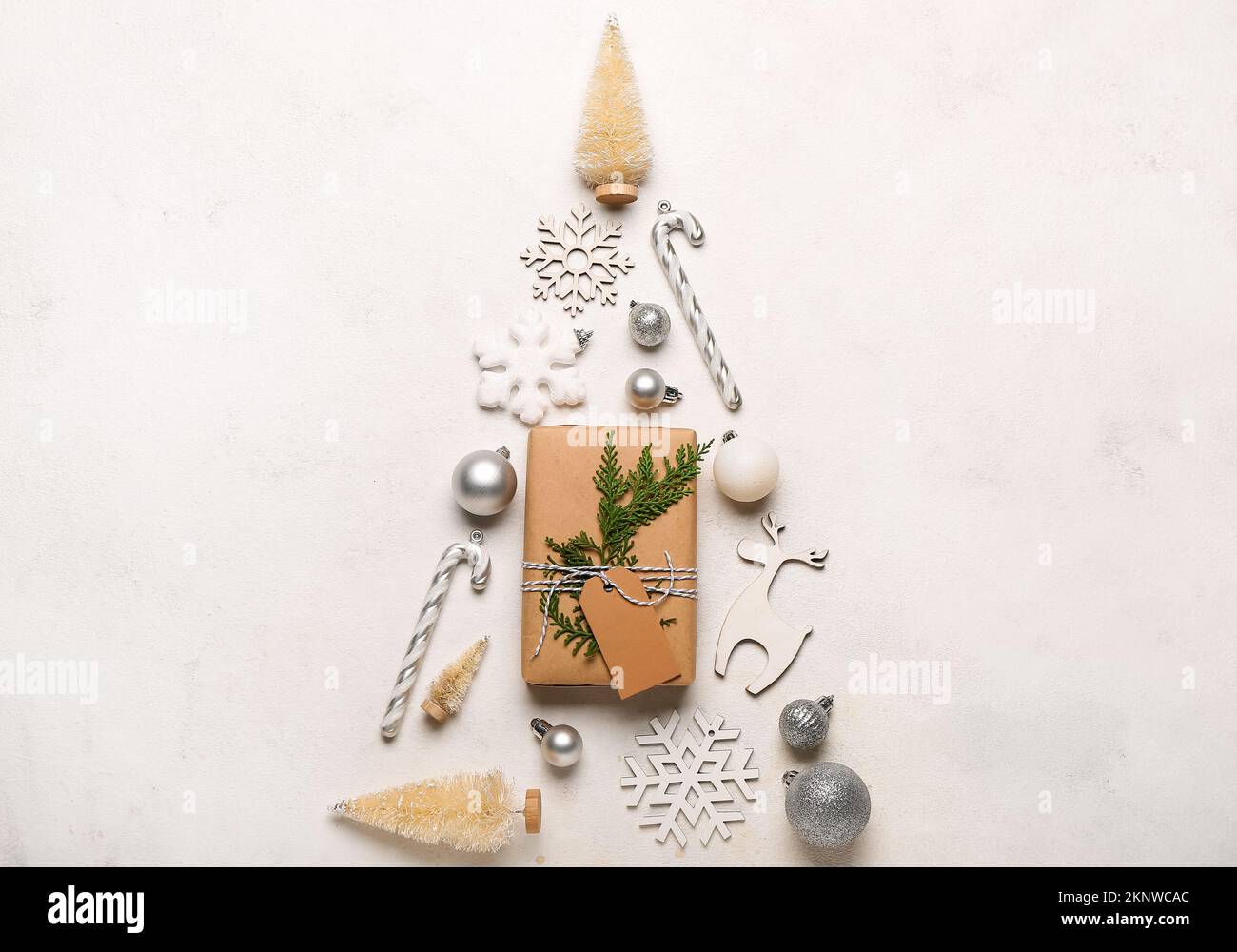 Christmas tree made of gift box and beautiful decorations on light ...