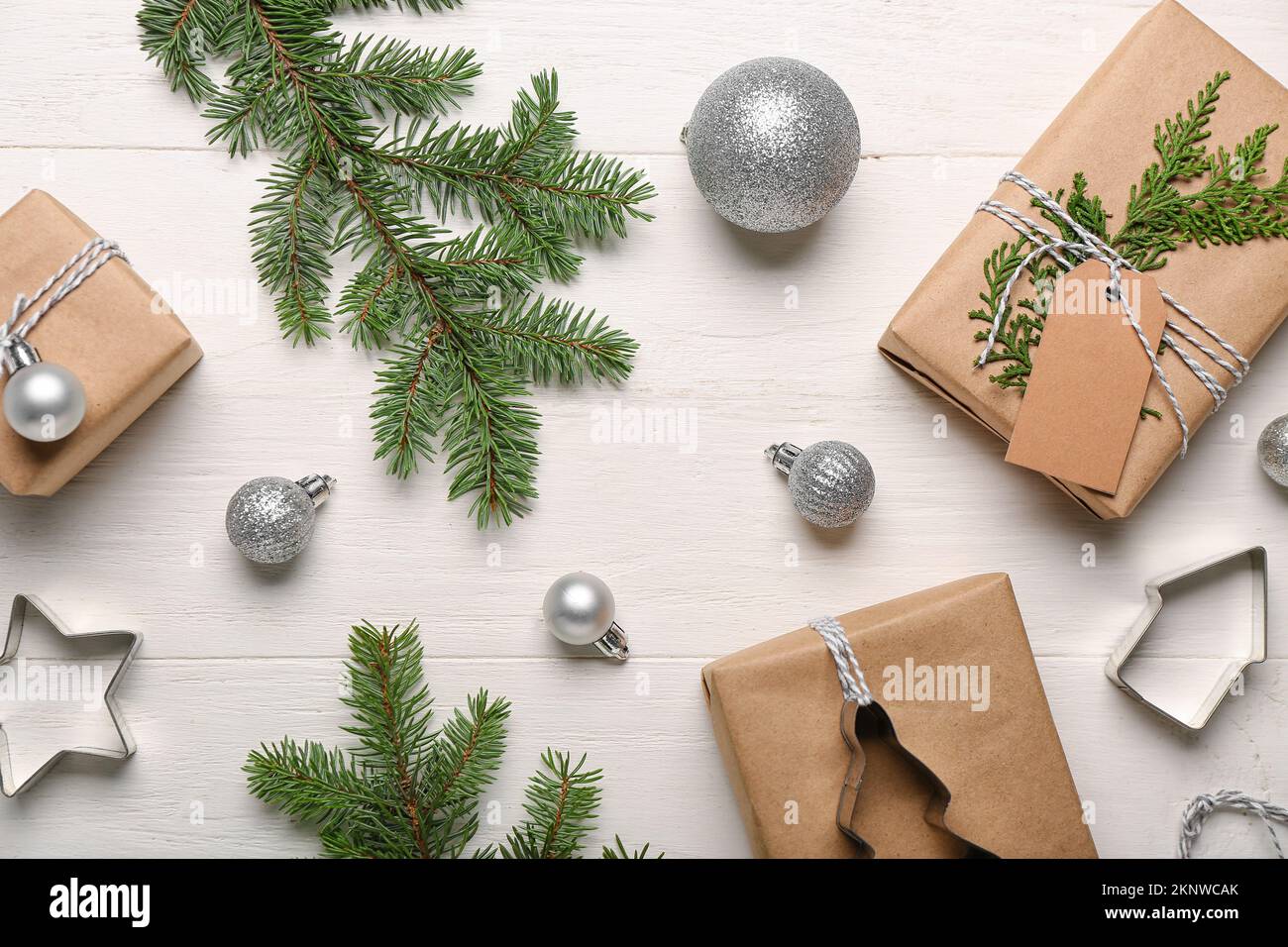 Composition with Christmas gifts, balls, fir branches and cookie ...