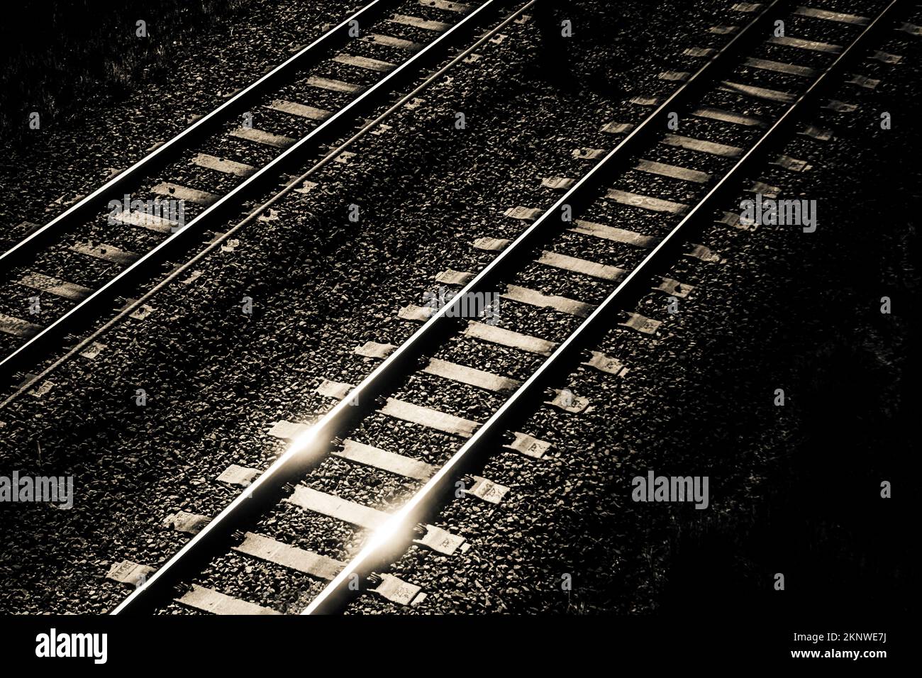 Linear parallels of rail transport with black tracks leading diagonally ...