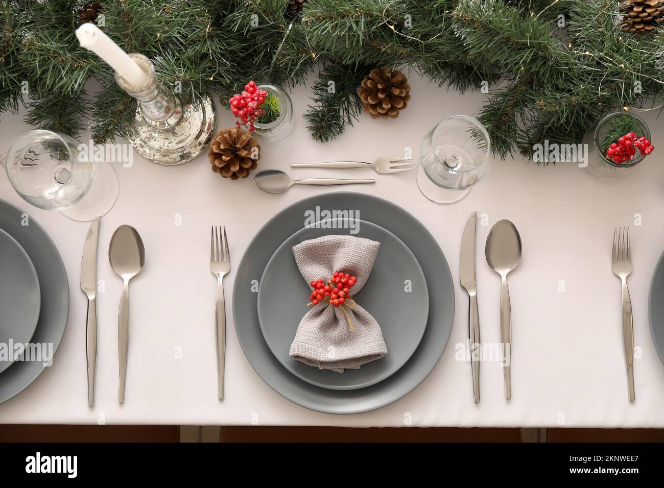 Christmas table setting with fir branches and rowan in dining room, top view Stock Photo - Alamy