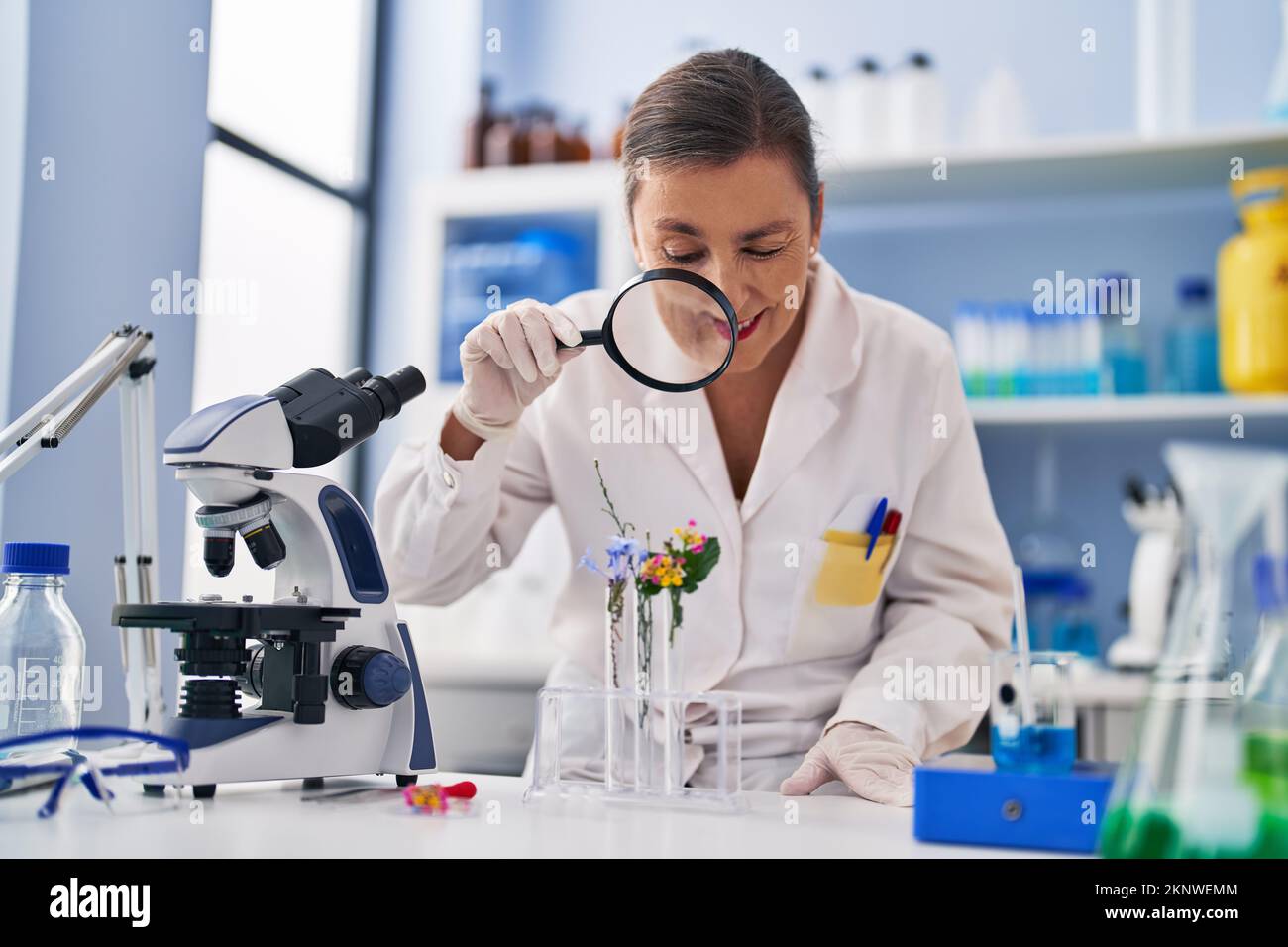 Female scientist looking plant leaf hi-res stock photography and images ...