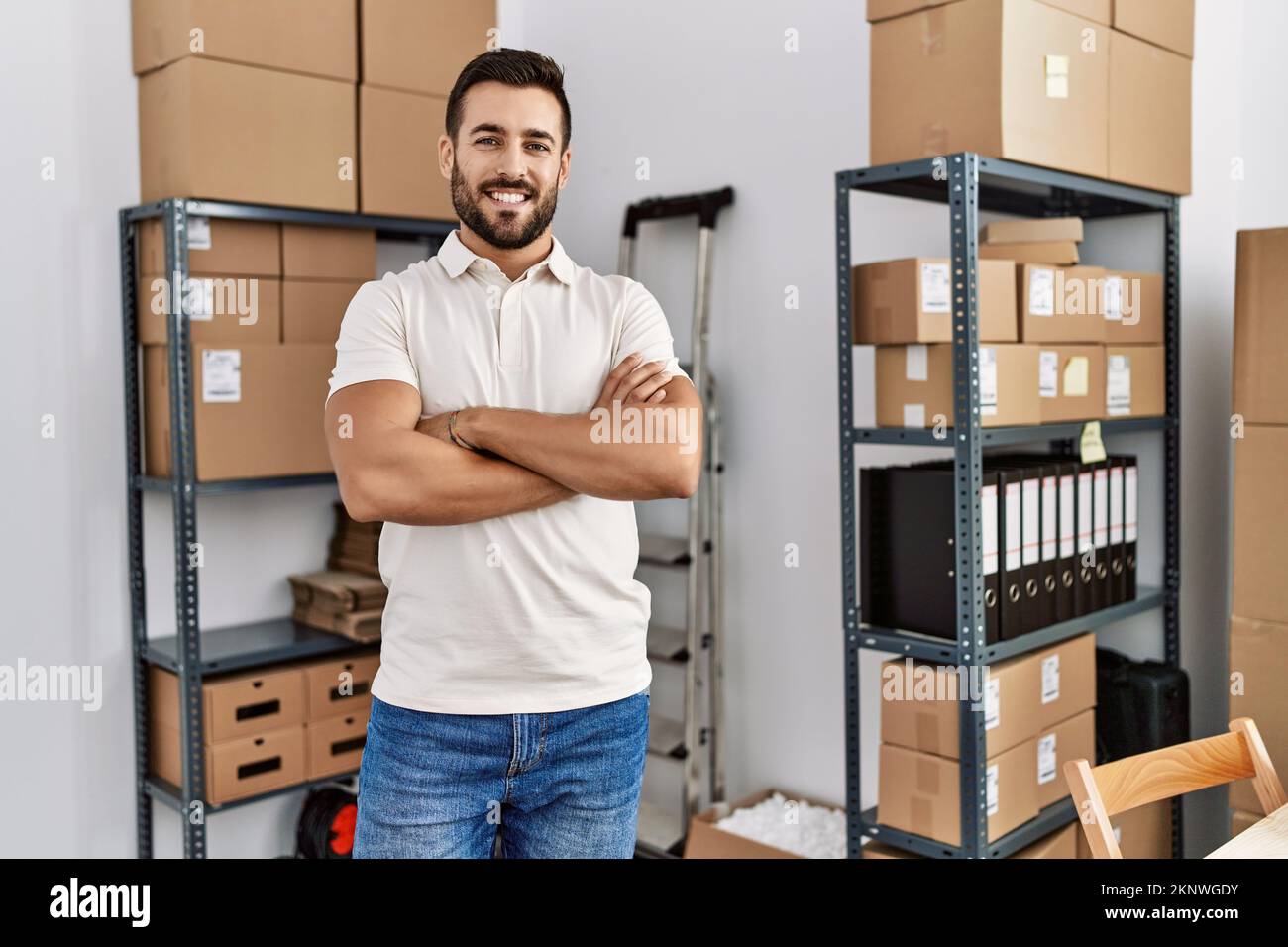 Young hispanic man smiling confident standing with arms crossed gesture ...