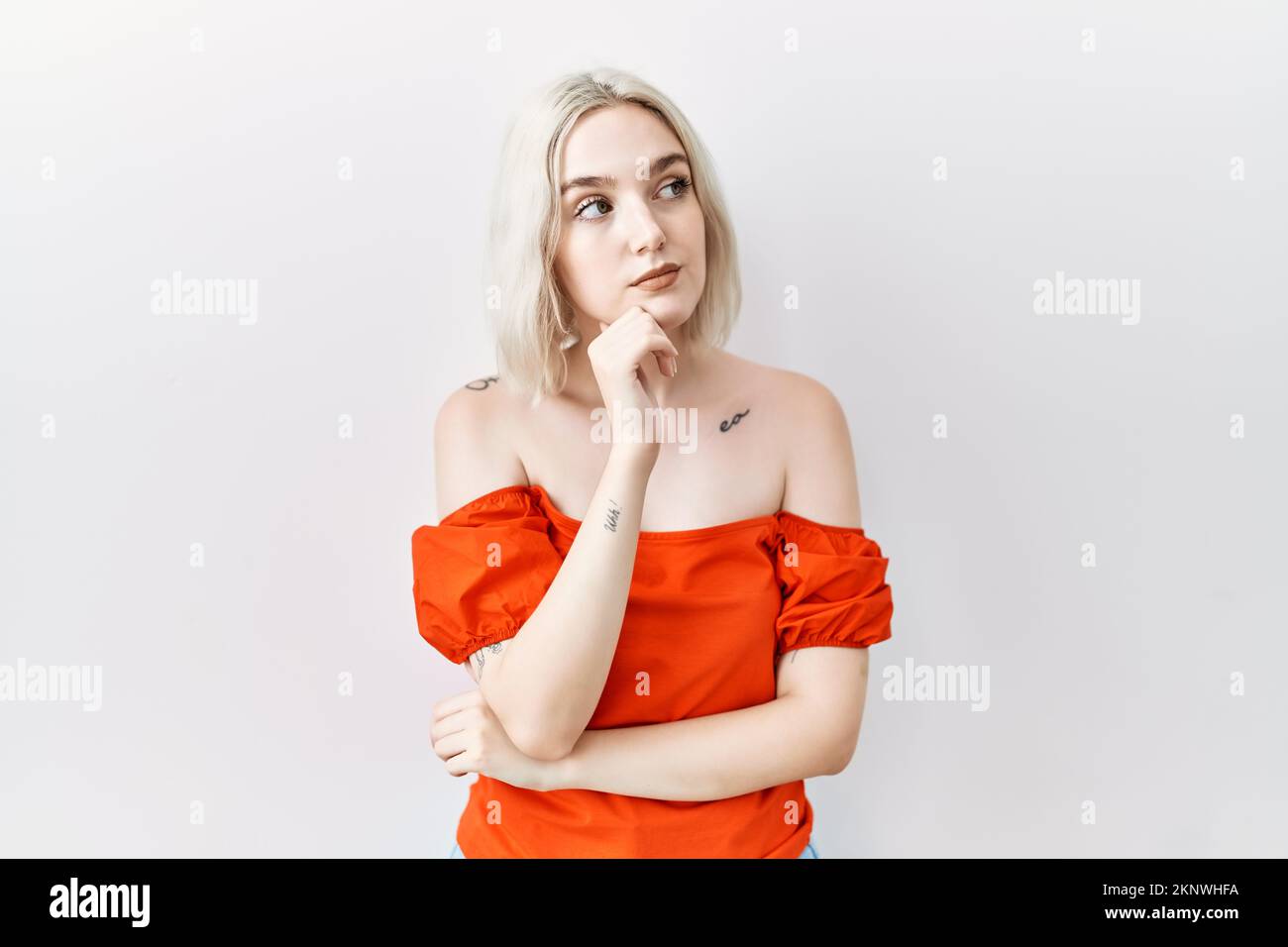 Young caucasian woman standing over isolated background with hand on ...