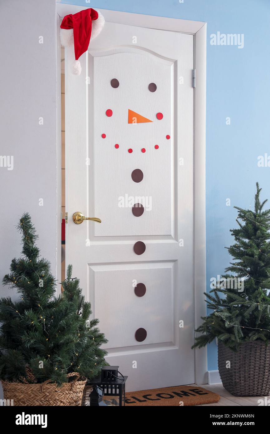 White door with snowman and Christmas trees in hall Stock Photo - Alamy