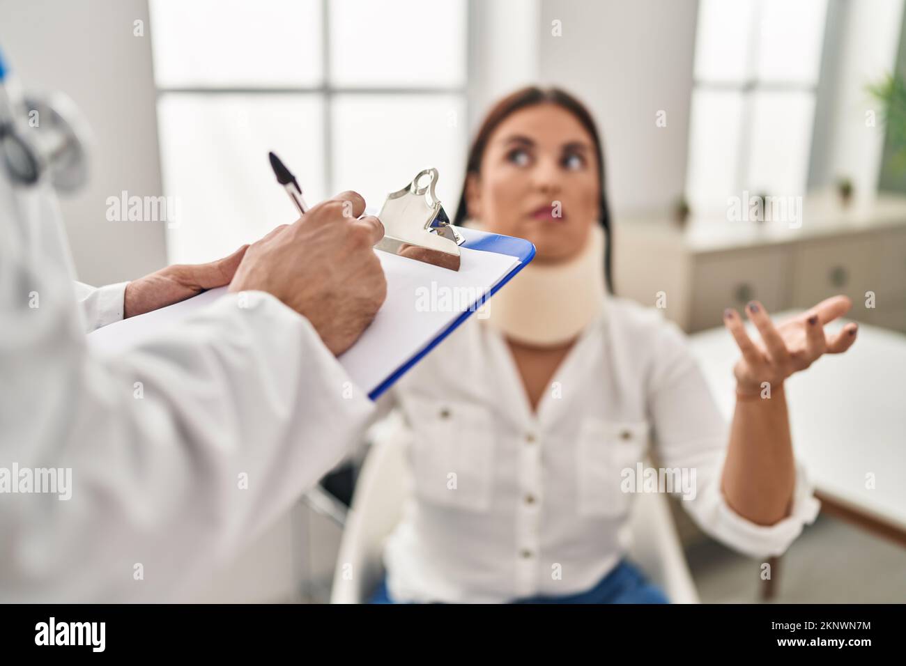 Man and woman doctor and patient having medical consultation for ...