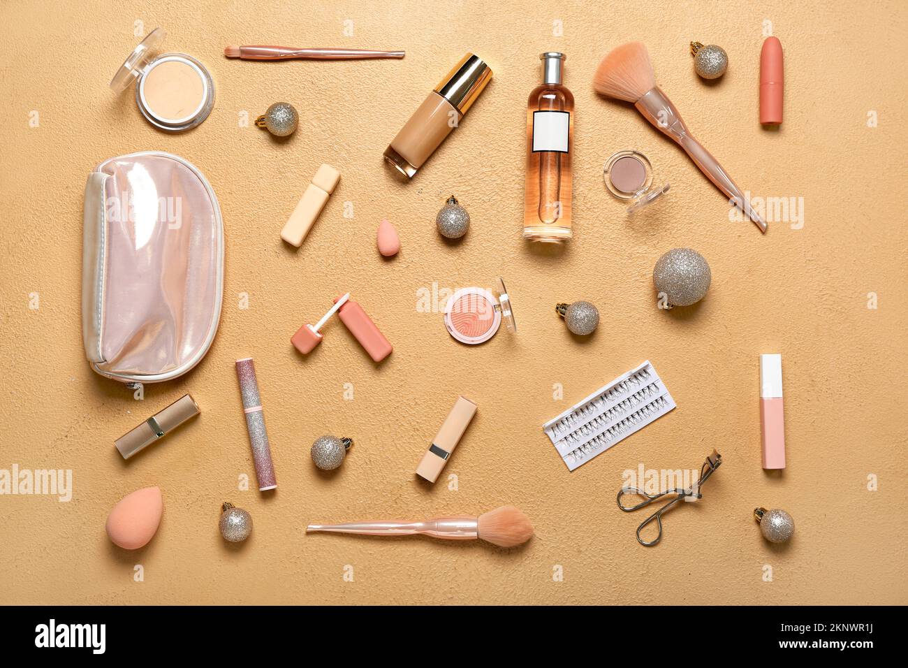 Makeup products with Christmas balls on beige background Stock Photo ...