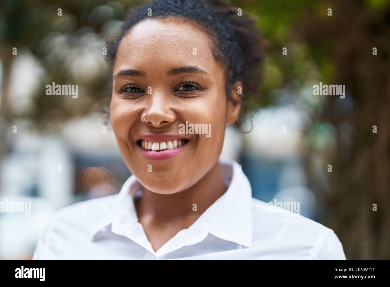 African american woman smiling confident standing at park Stock Photo ...