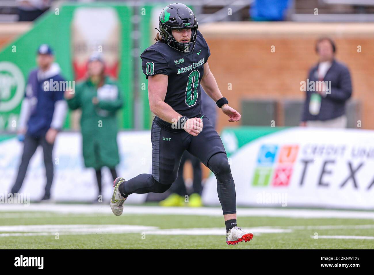 November 26, 2022: North Texas Mean Green place kicker Ethan Mooney (0) runs down field during ...