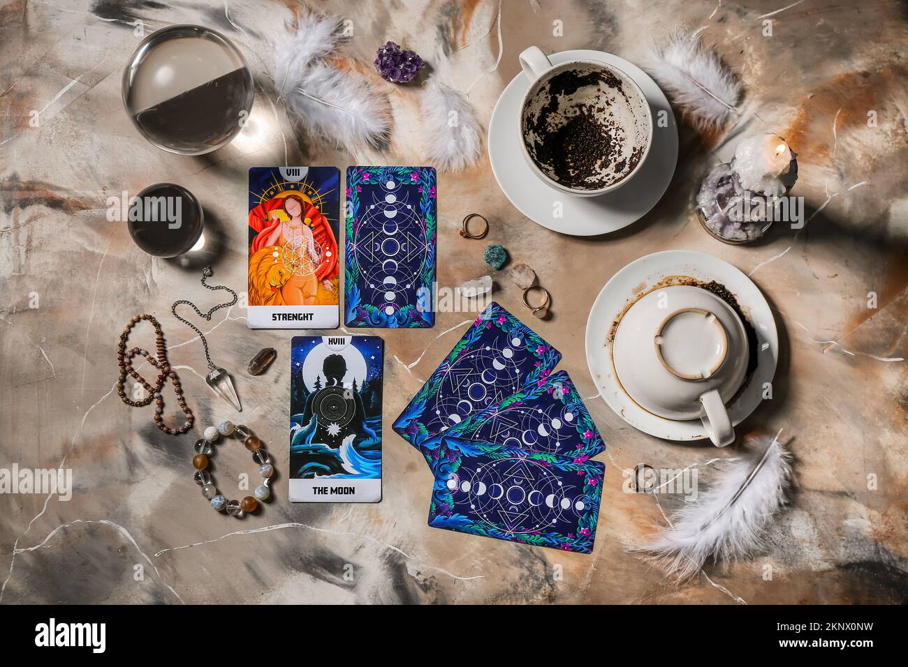 Magic attributes of soothsayer and tarot cards on table Stock Photo - Alamy