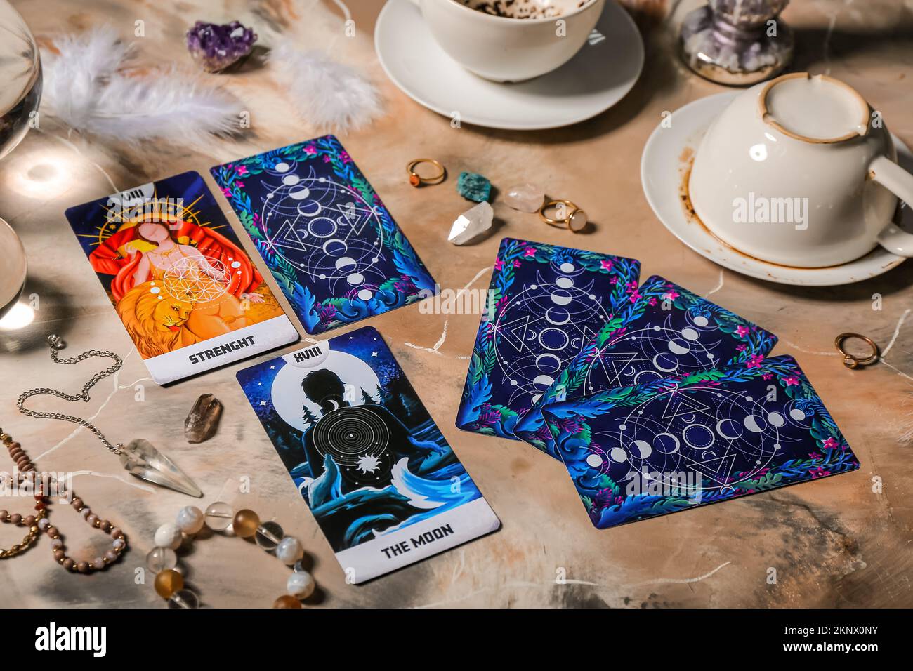 Magic attributes of soothsayer and tarot cards on table Stock Photo - Alamy