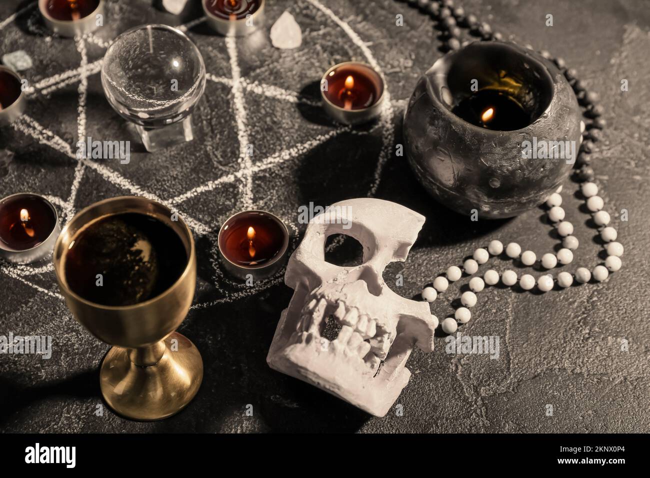 Magic attributes for ritual on dark table Stock Photo - Alamy