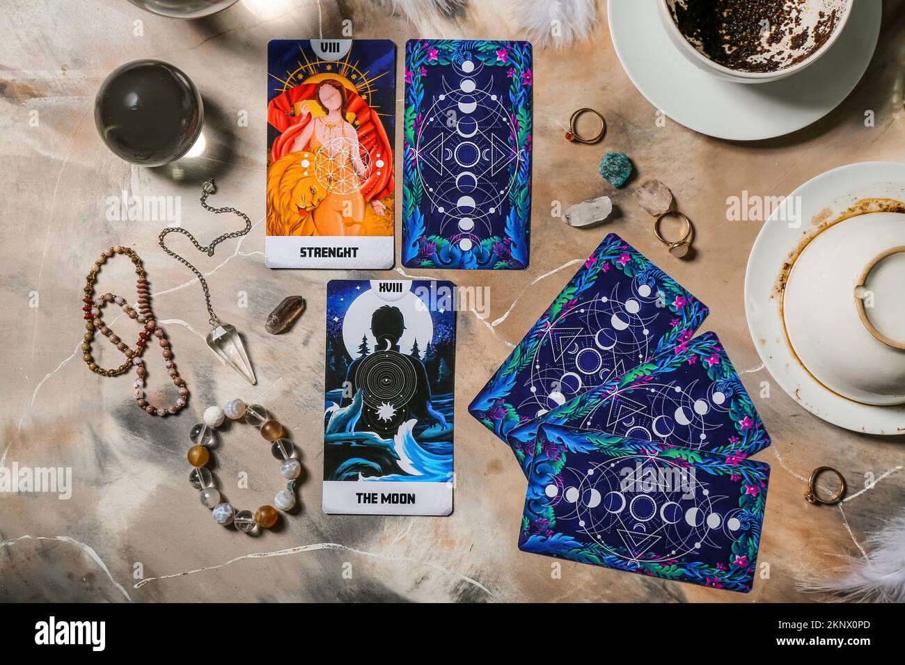 Magic attributes of soothsayer and tarot cards on table Stock Photo - Alamy