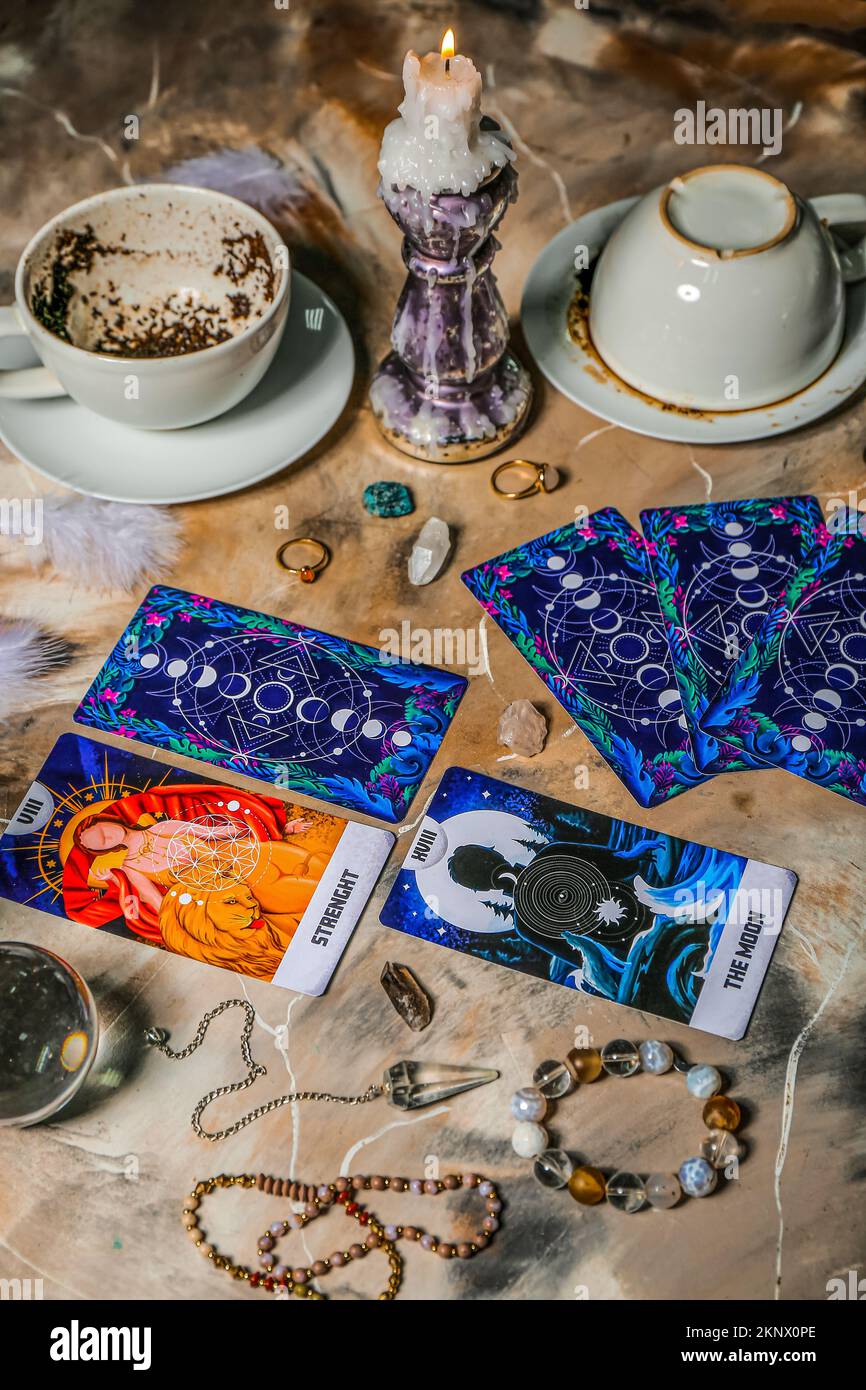 Magic attributes of soothsayer and tarot cards on table Stock Photo - Alamy