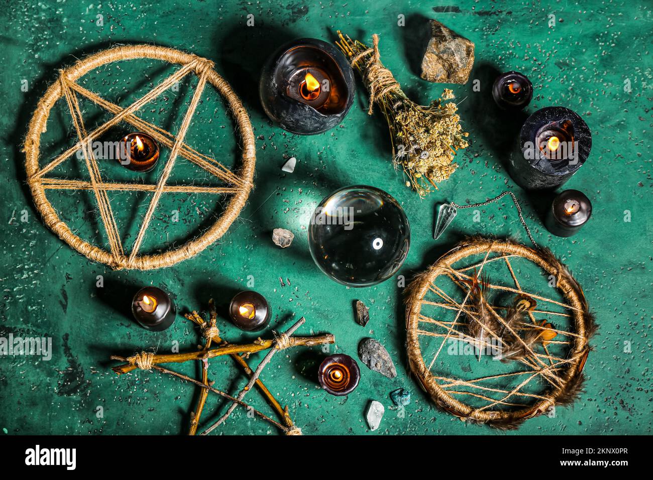Magic attributes of fortune teller on green table Stock Photo - Alamy